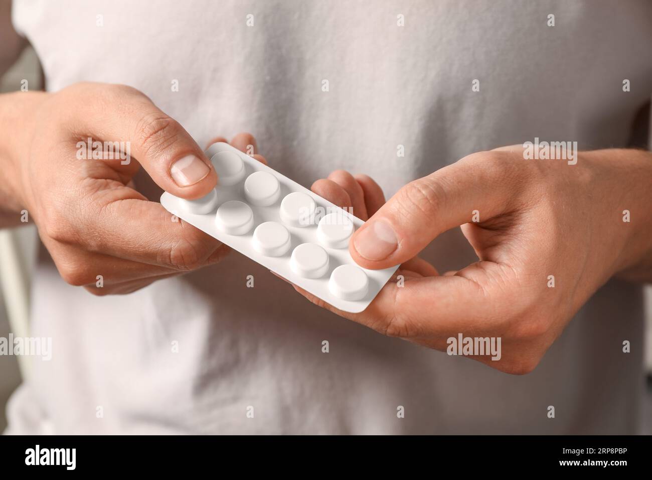 Young man taking medicine from hi-res stock photography and images - Alamy