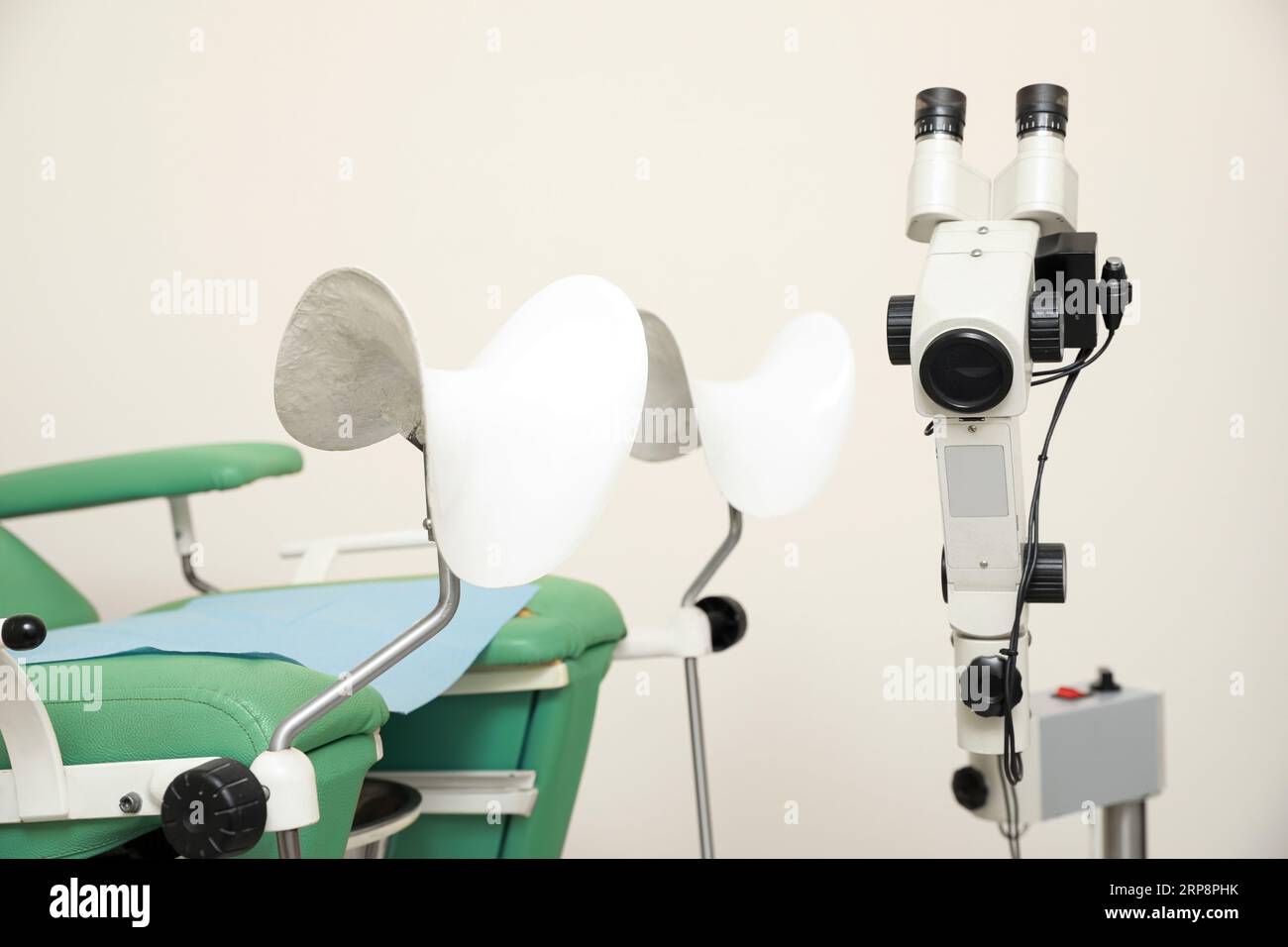 Modern binocular colposcope and gynecological chair in clinic Stock ...