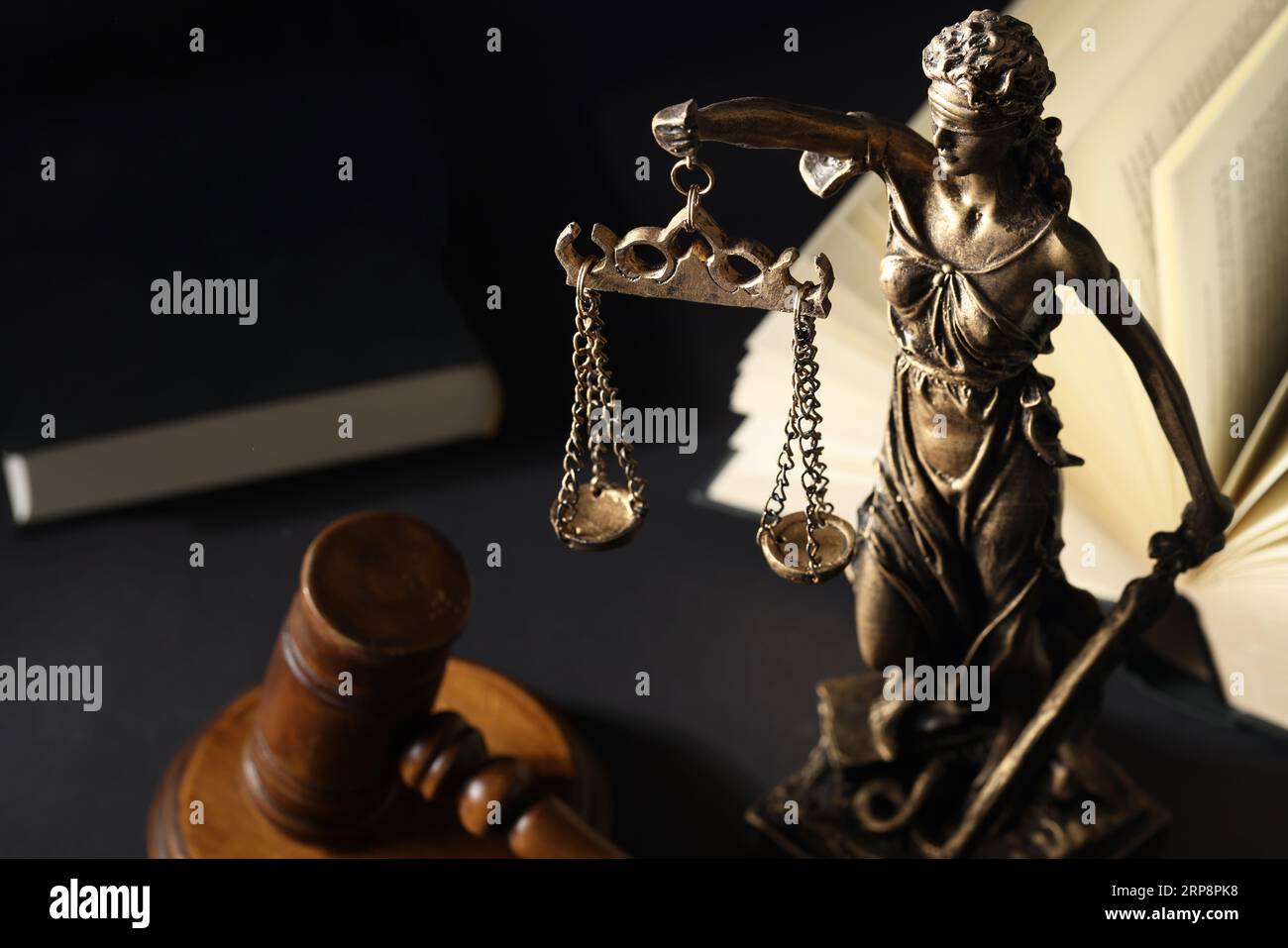 Symbol of fair treatment under law. Statue of Lady Justice near gavel ...
