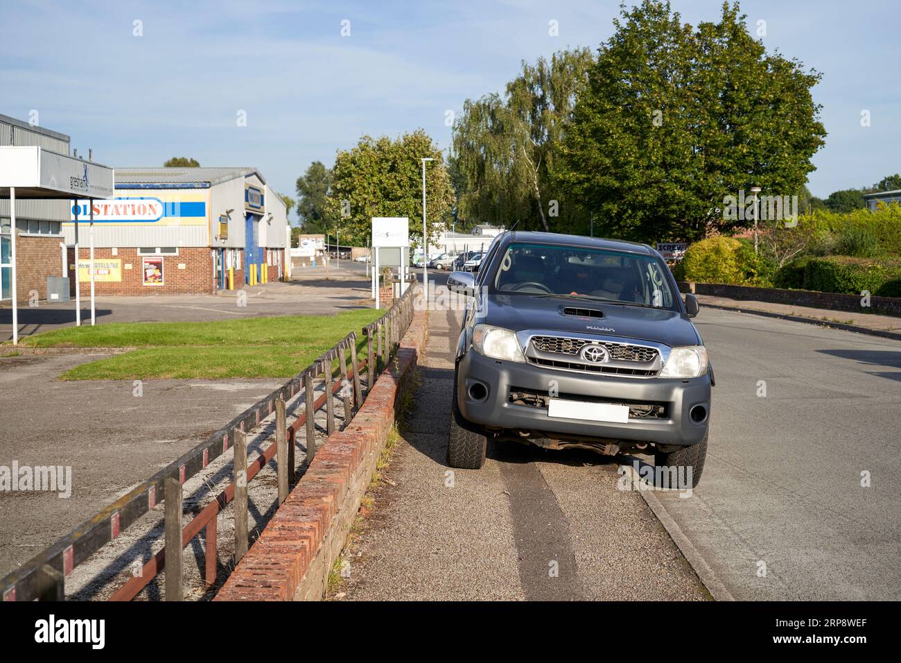 Vehicle parked on a pavement illegally Stock Photo - Alamy