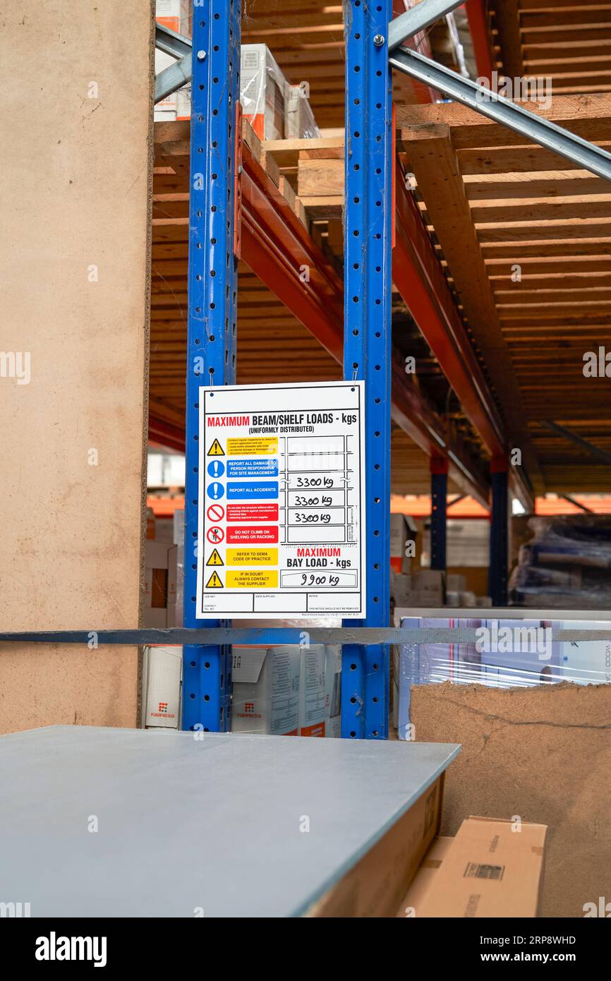 Safety recommendations sign attached to metal racking Stock Photo - Alamy