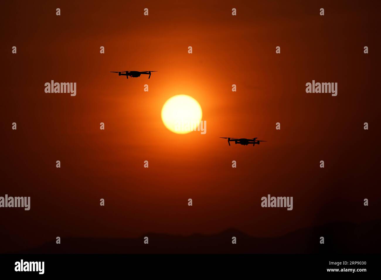 (190319) -- BEIJING, March 19, 2019 (Xinhua) -- Two drones fly against ...