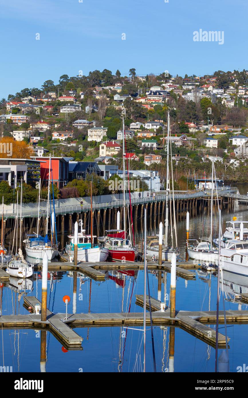 Seaport Marina on the Esk River looking towards the hilltop suburb of ...