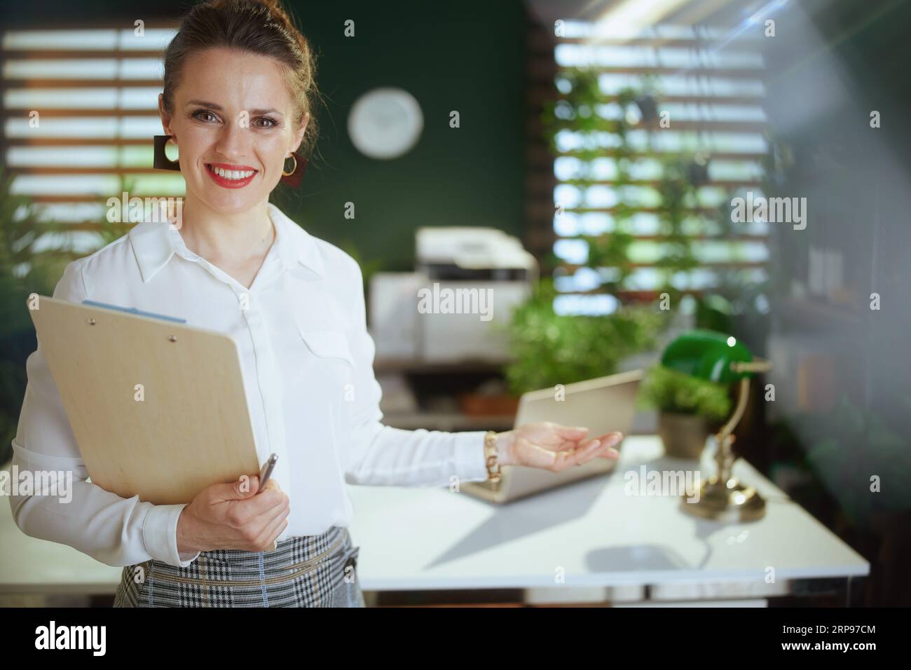 Sustainable real estate business. smiling modern female realtor in ...