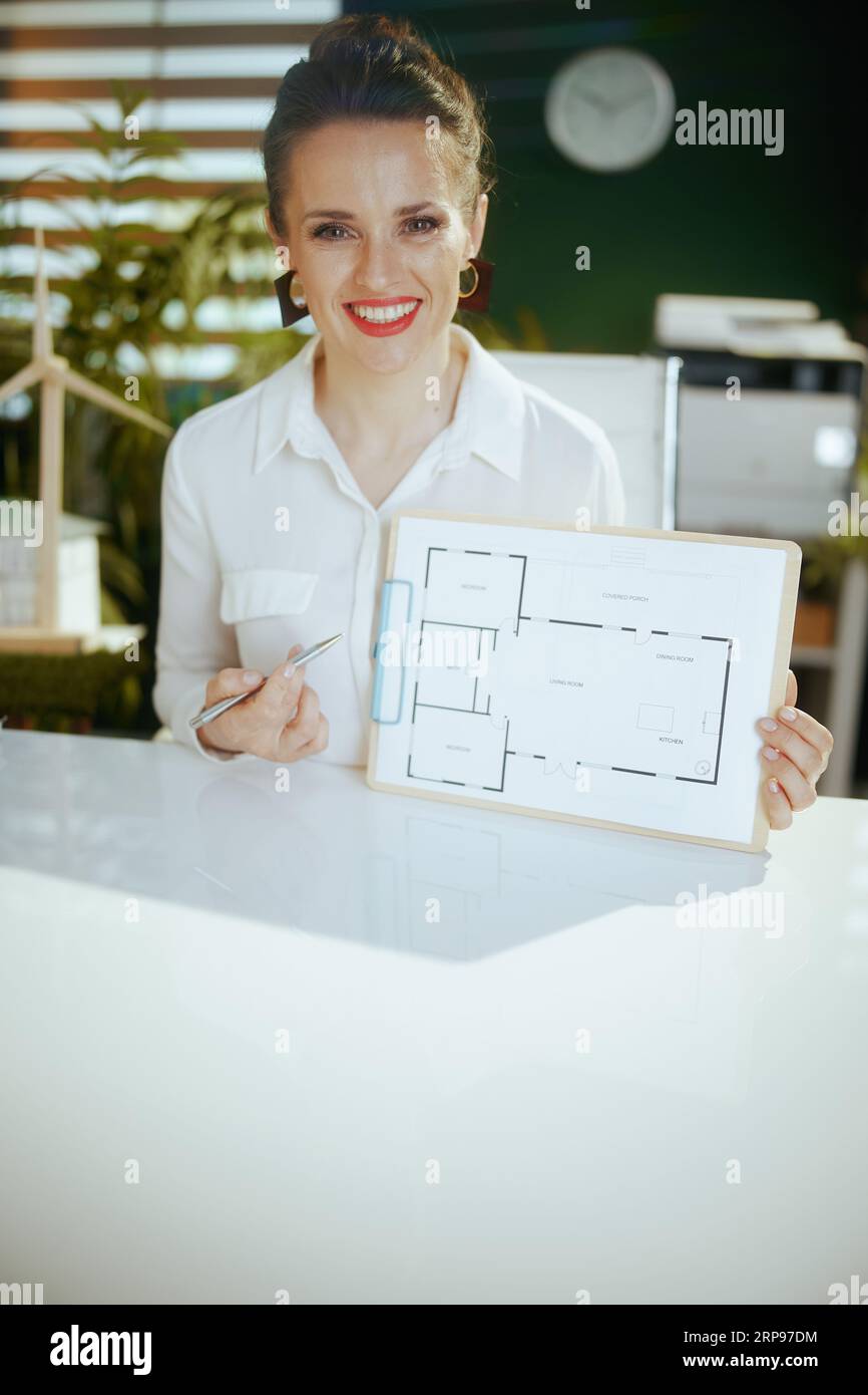 Time to move on. smiling elegant 40 years old woman real estate agent ...