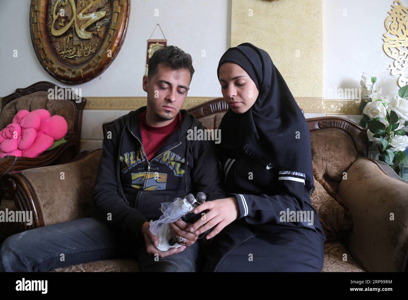 (190329) -- GAZA, March 29, 2019 -- Palestinian Walid al-Shawa and his fiancee Naila al-Jalis ...