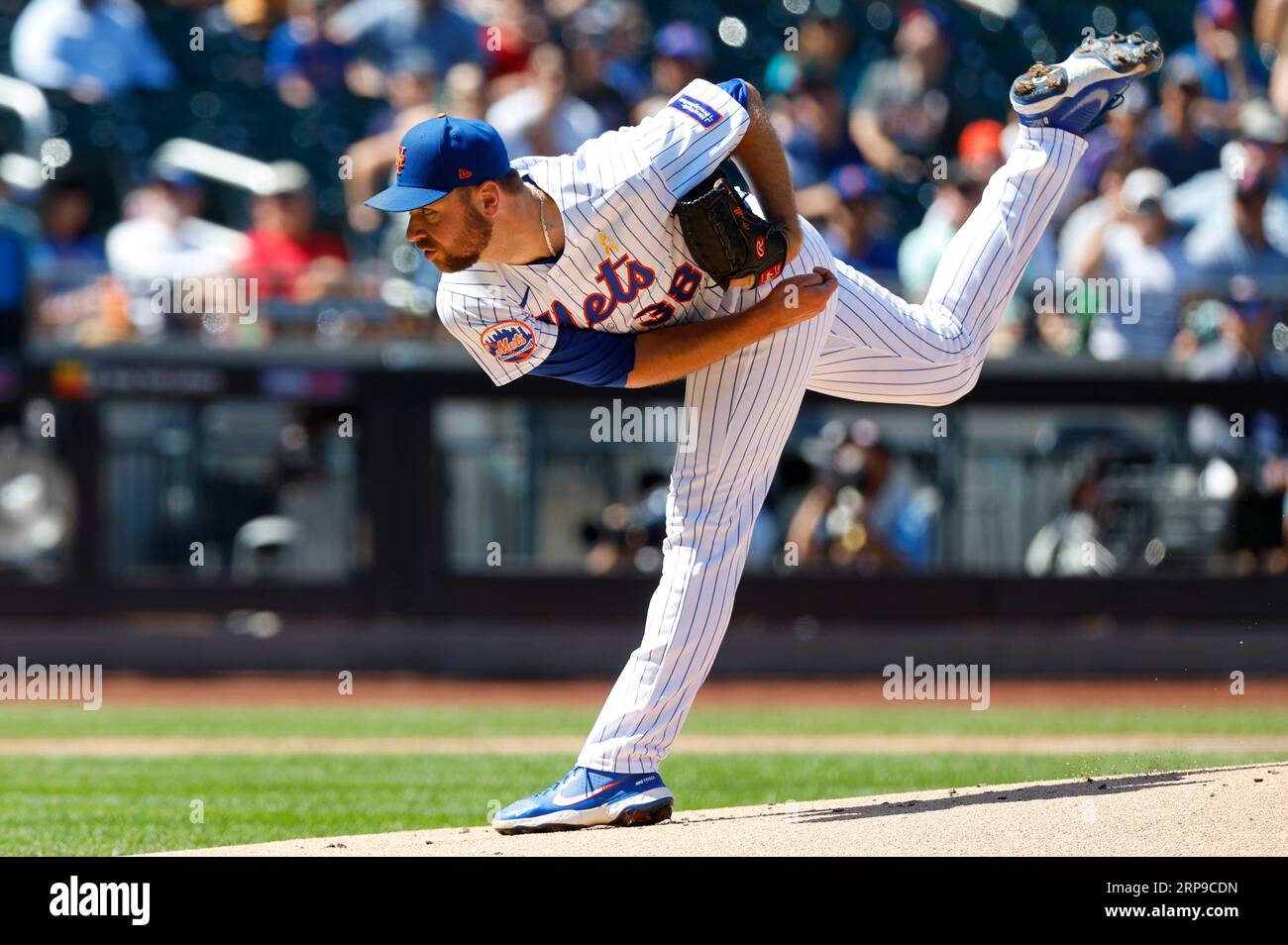New York Mets starting pitcher Tylor Megill (38) throws against the ...