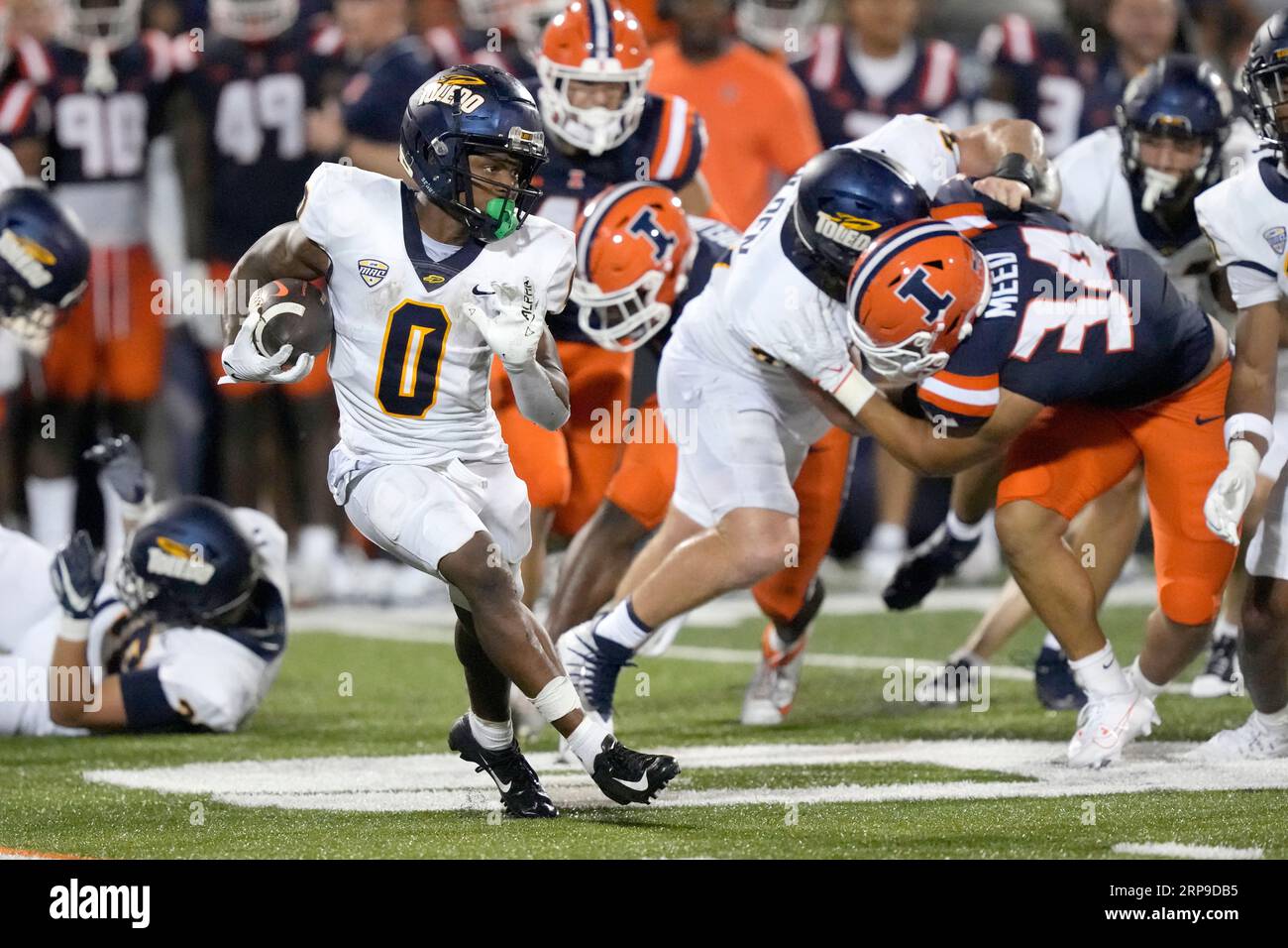 Toledo running back Jacquez Stuart carries the ball during an NCAA ...