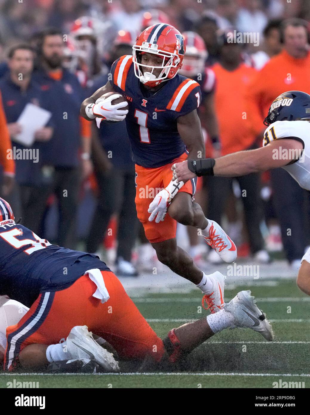 Illinois wide receiver Isaiah Williams leaps over a teammate after a ...