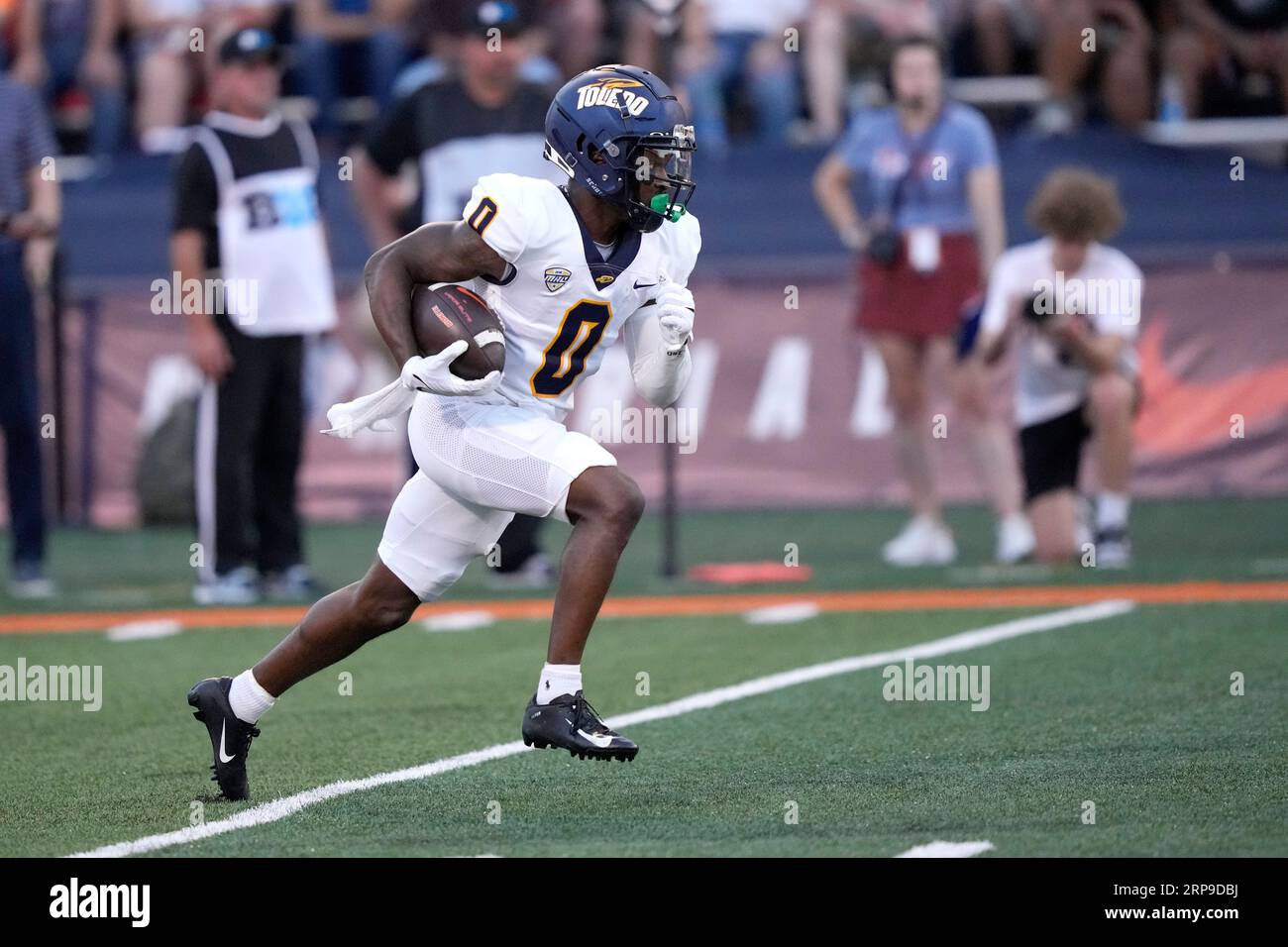 Toledo running back Jacquez Stuart returns a kickoff during an NCAA ...