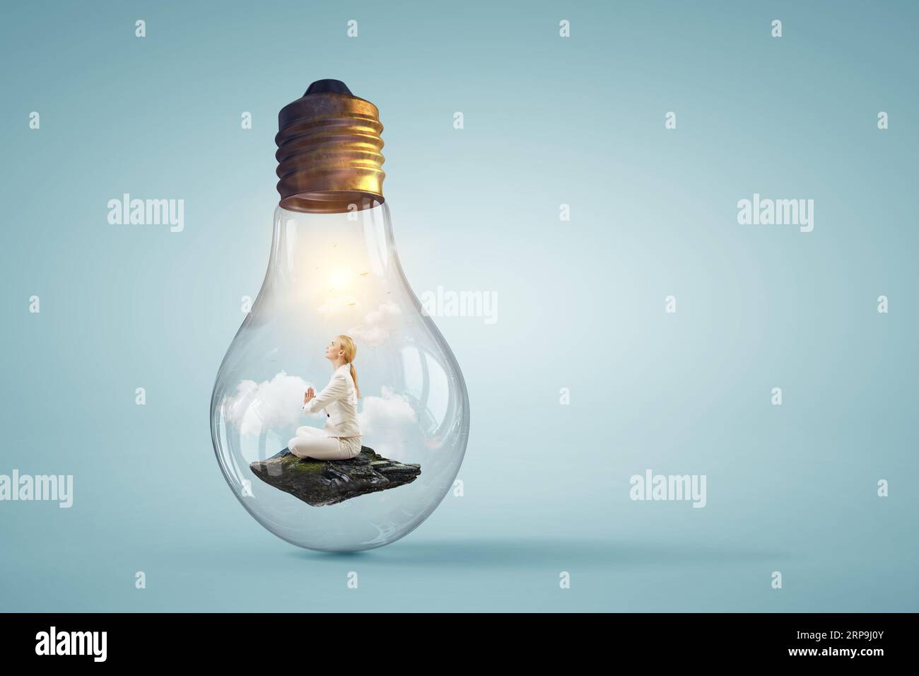 Business woman doing yoga in lotus pose inside light bulb Stock Photo ...