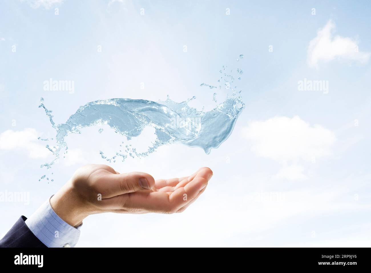 Hands with water splash . Mixed media Stock Photo - Alamy