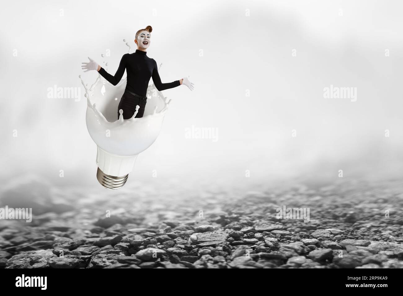 Female mime and light bulb Stock Photo - Alamy