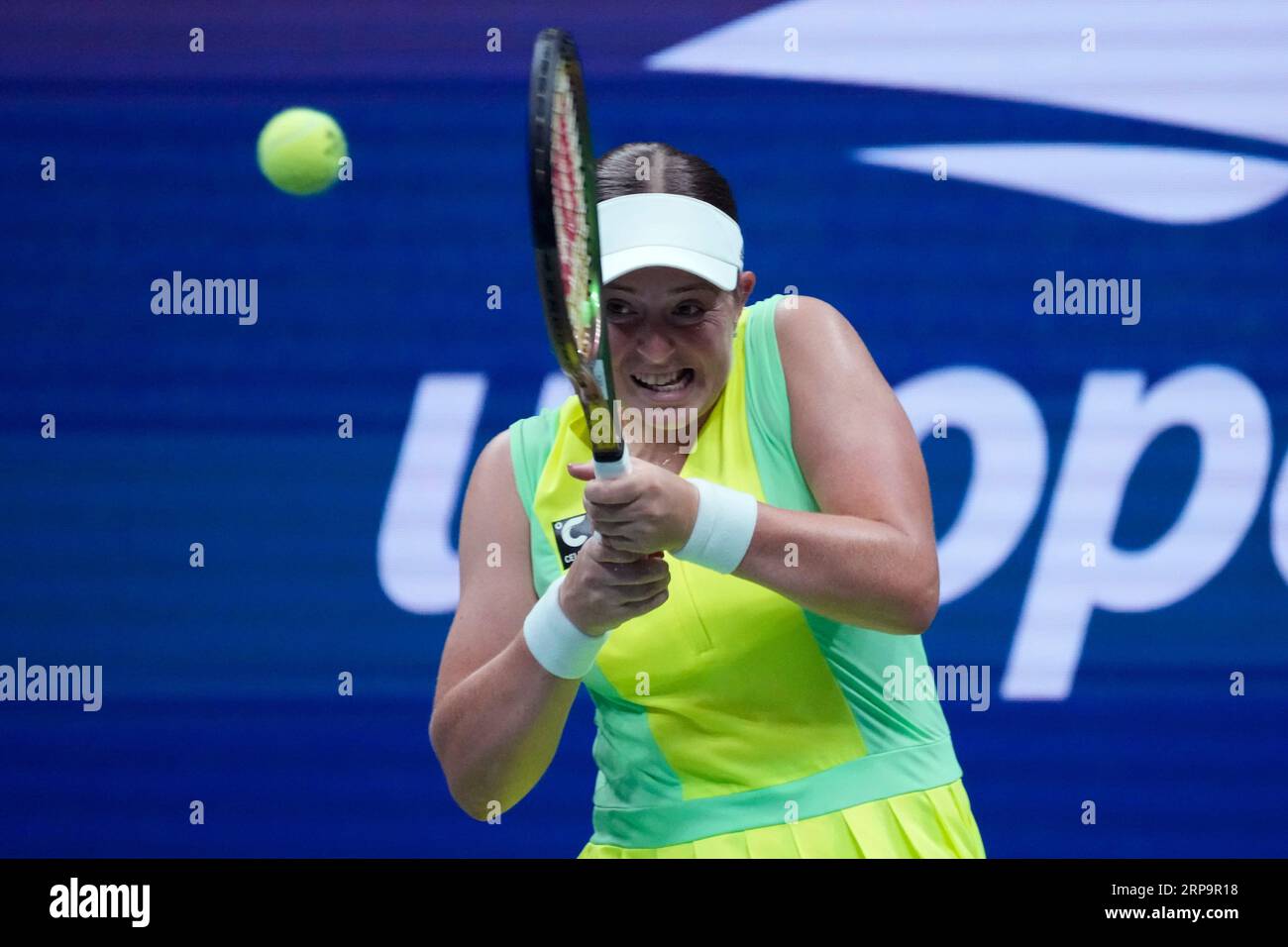 Jelena Ostapenko, of Latvia, returns to Iga Swiatek, of Poland, during the fourth round of the U ...