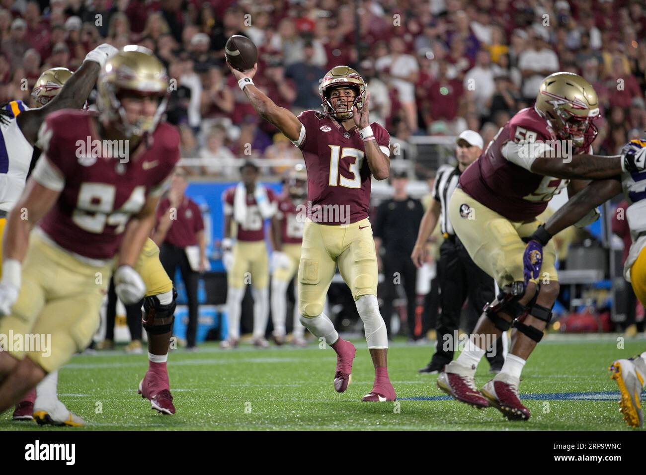 Florida State quarterback Jordan Travis (13) throws for a 7-yard ...