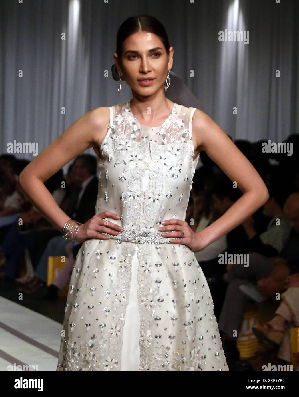 (190420) -- KARACHI, April 20, 2019 -- A model presents a creation by ...