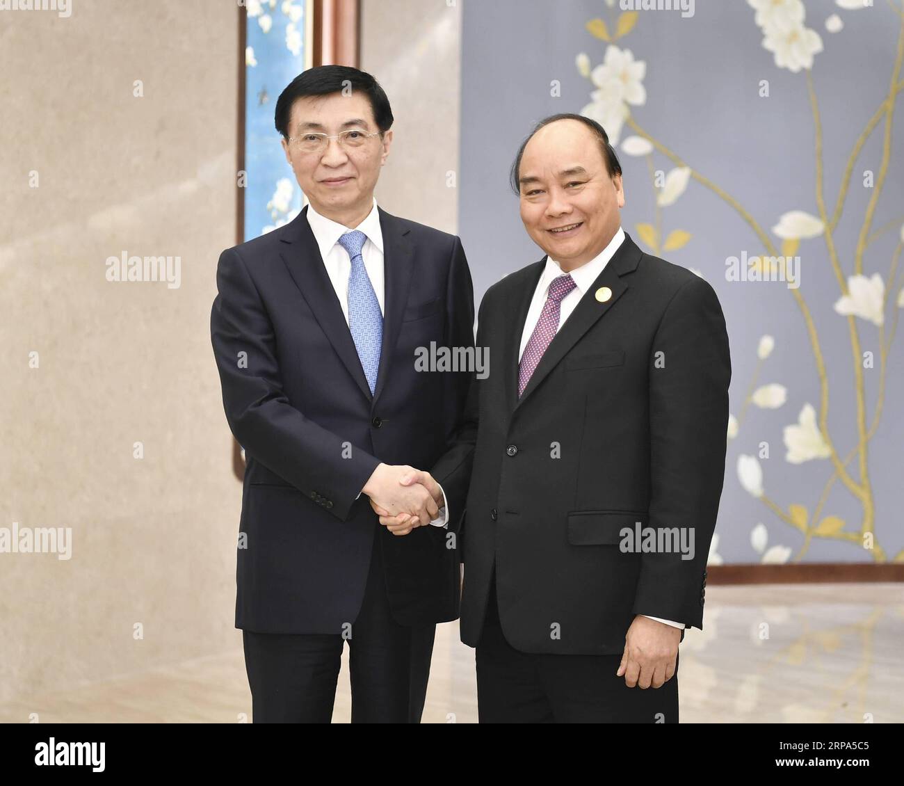 (190425) -- BEIJING, April 25, 2019 -- Wang Huning (L), a member of the ...