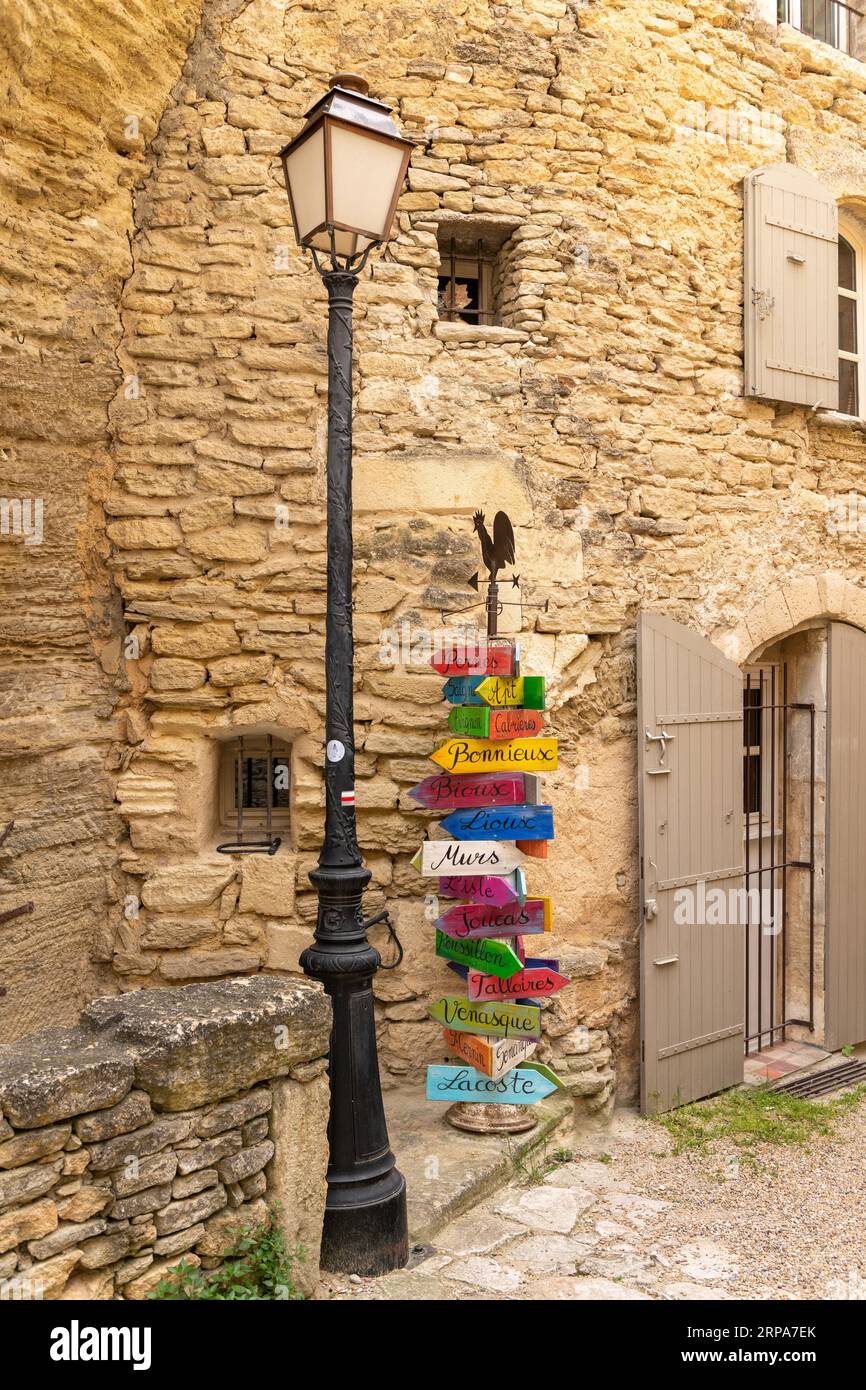 Colorful street lamps with directional signage in a cityscape Stock ...