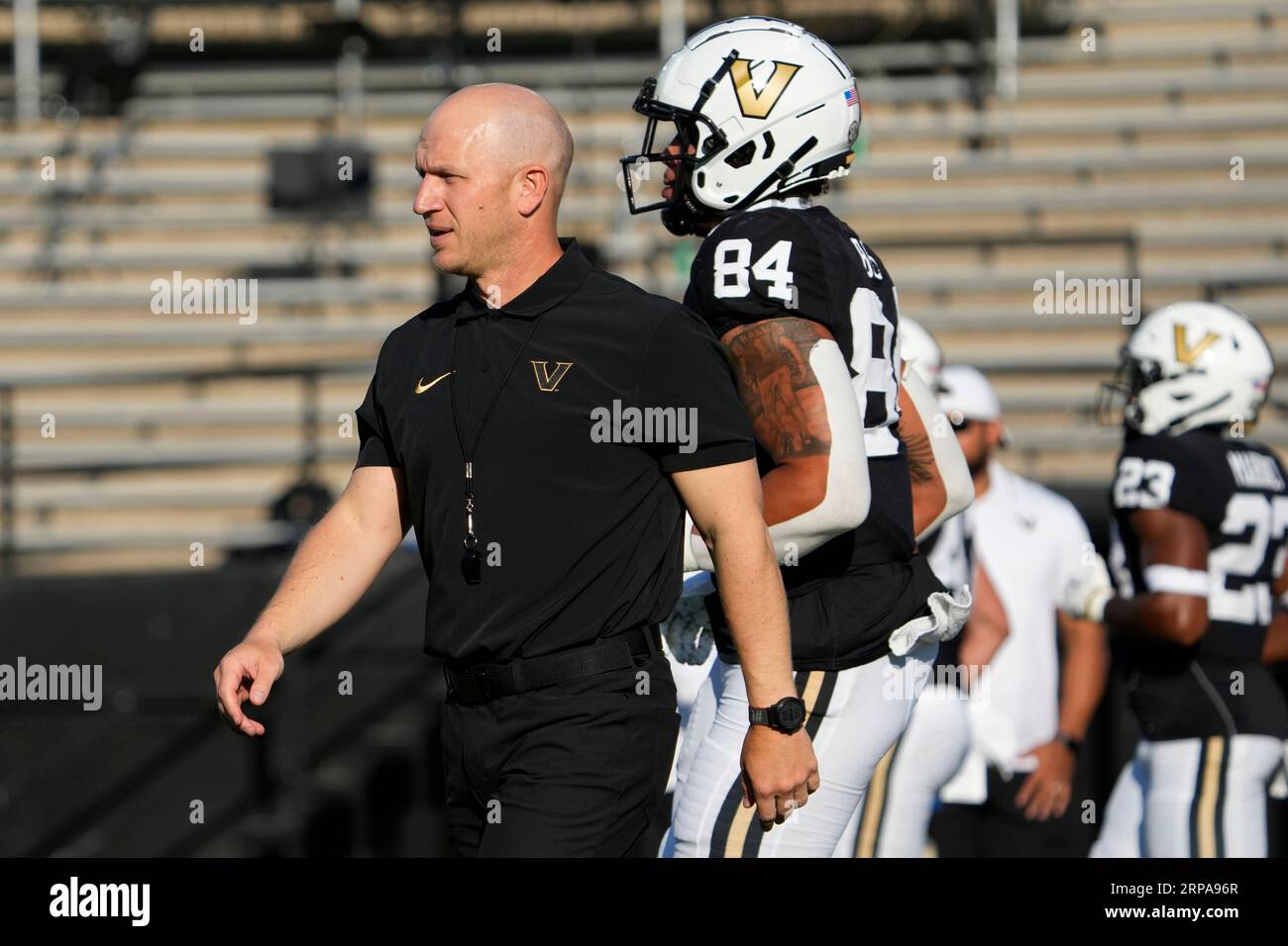 Vanderbilt head coach Clark Lea watches his players warm up before an ...