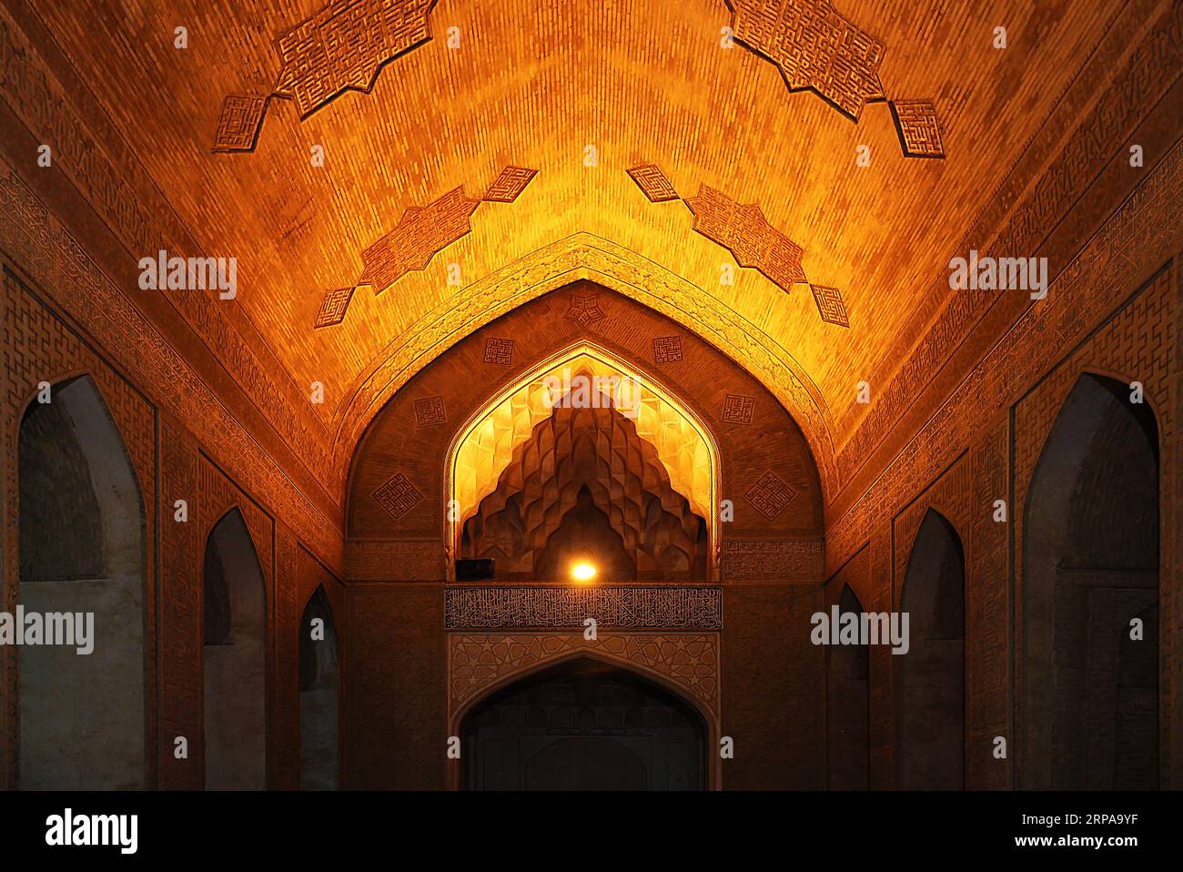 A traditional two-story house features an illuminated front entrance ...