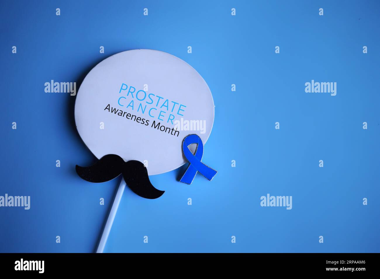 Mustache and blue ribbon with text PROSTATE CANCER AWARENESS MONTH ...