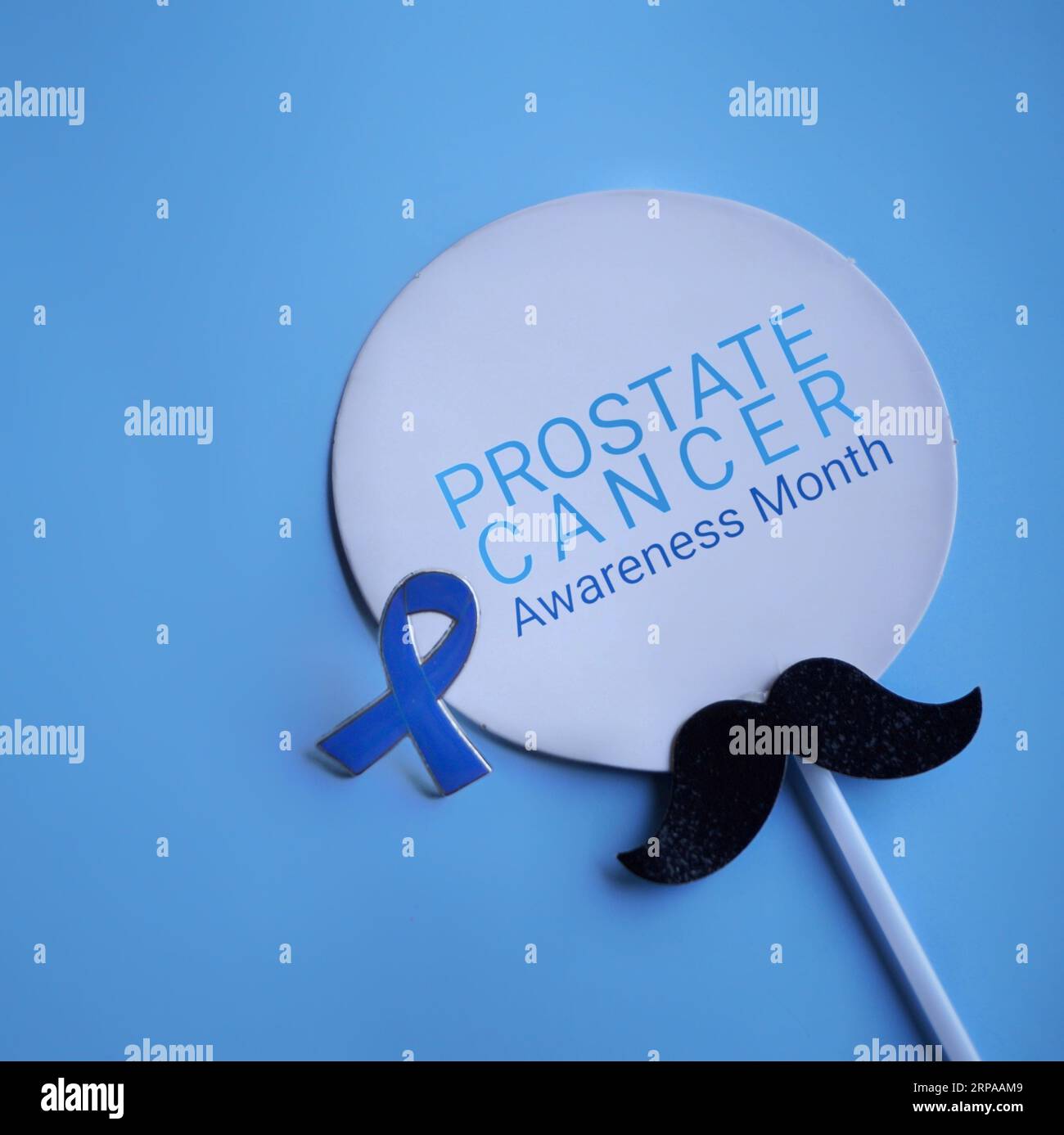 Mustache and blue ribbon with text PROSTATE CANCER AWARENESS MONTH ...