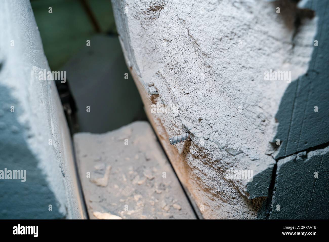 The wall of aerated concrete bricks is cut through close-up. Metal ...