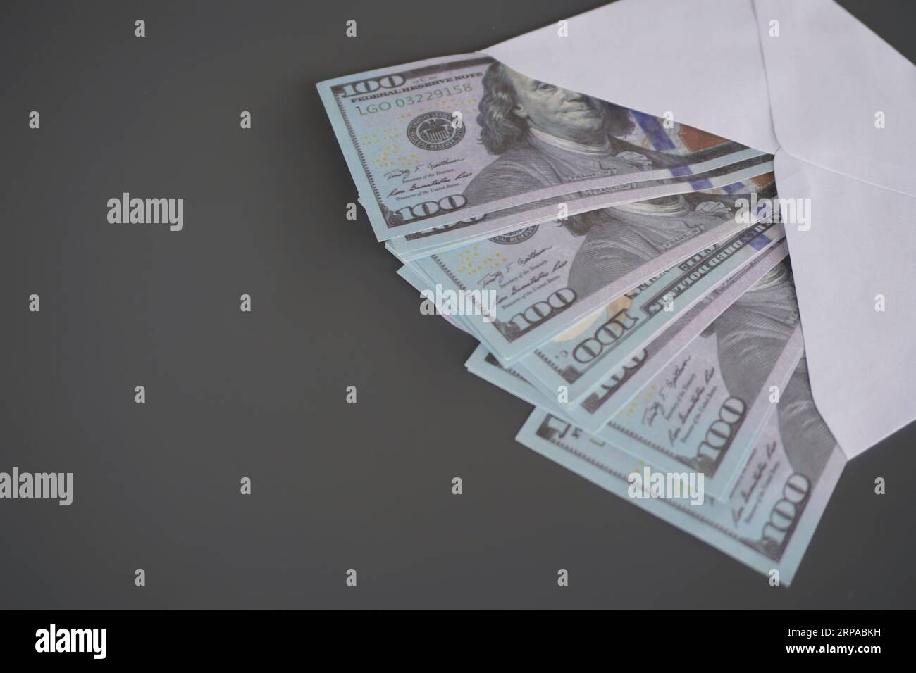Top view image of money inside white envelope. Financial, bribery and ...