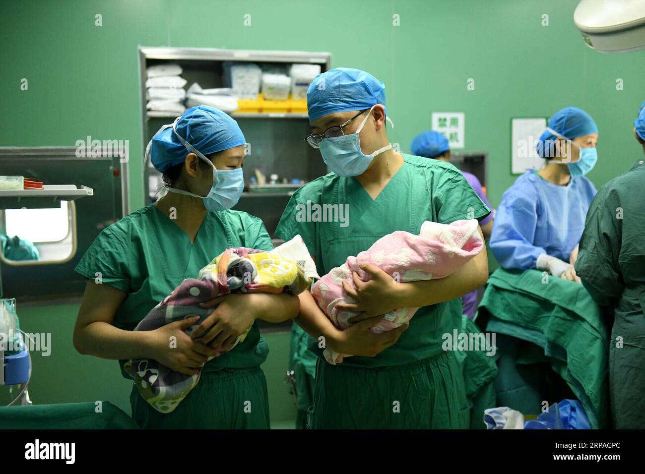 Nurses hold babies hi-res stock photography and images - Alamy