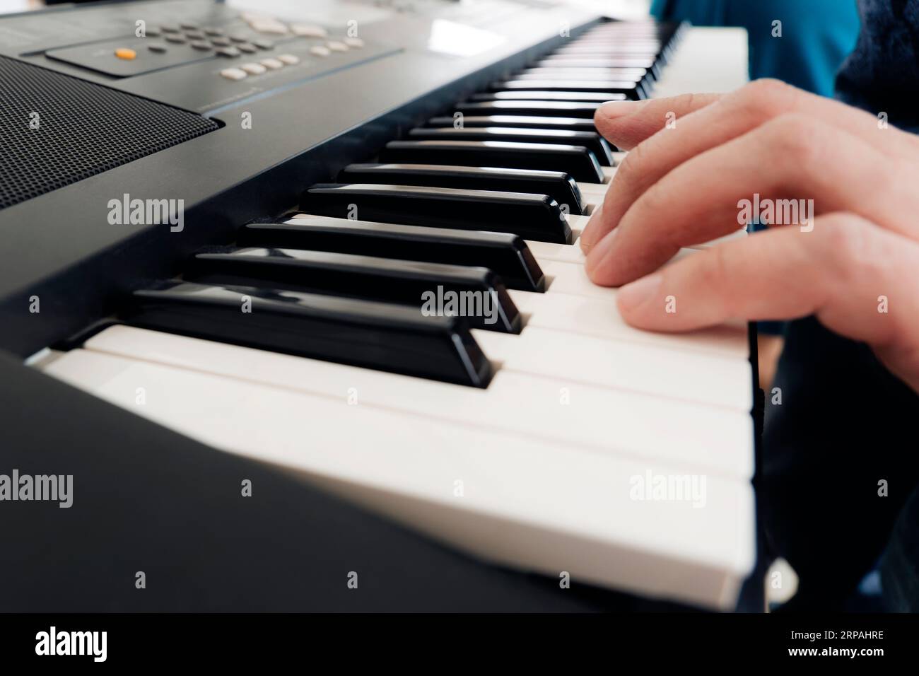 The concept of playing musical instruments - the men's hands on the ...