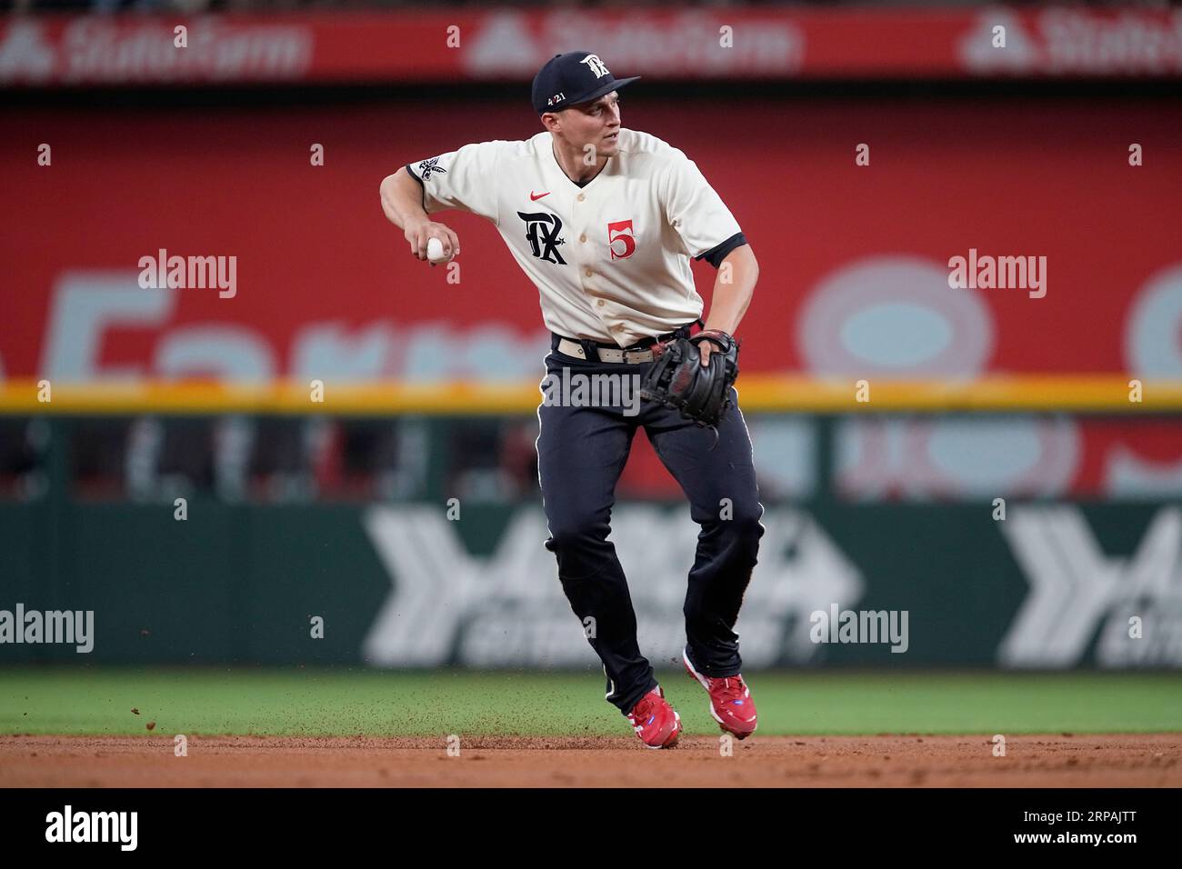 Texas Rangers shortstop Corey Seager throws to first after fielding a ...