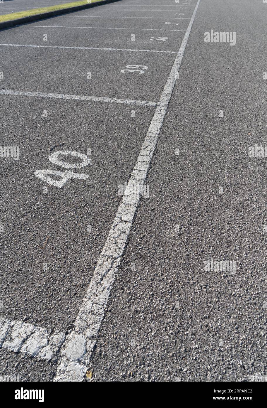 the numbering drawn on the pavement of a car park Stock Photo - Alamy