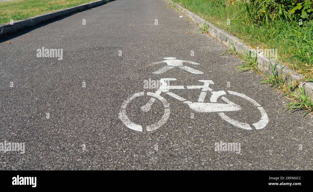 the symbol drawn on the pavement of a cycle path Stock Photo - Alamy