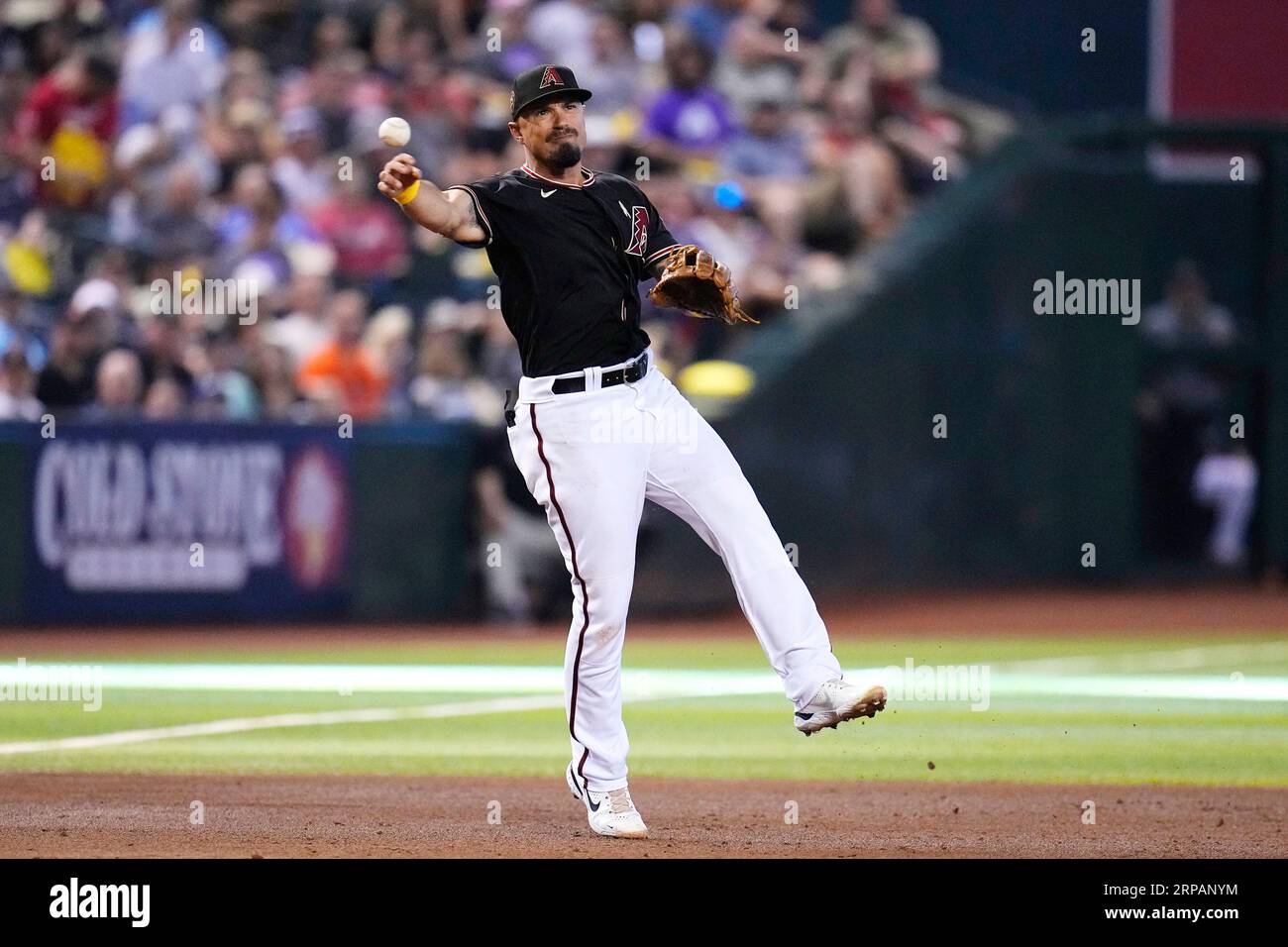 Arizona Diamondbacks third baseman Jace Peterson throws to first base ...