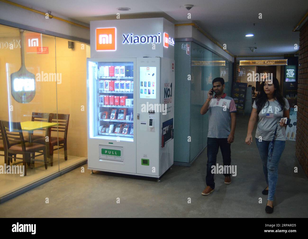 (190518) -- BANGALORE, May 18, 2019 -- People walk past the first Mi ...