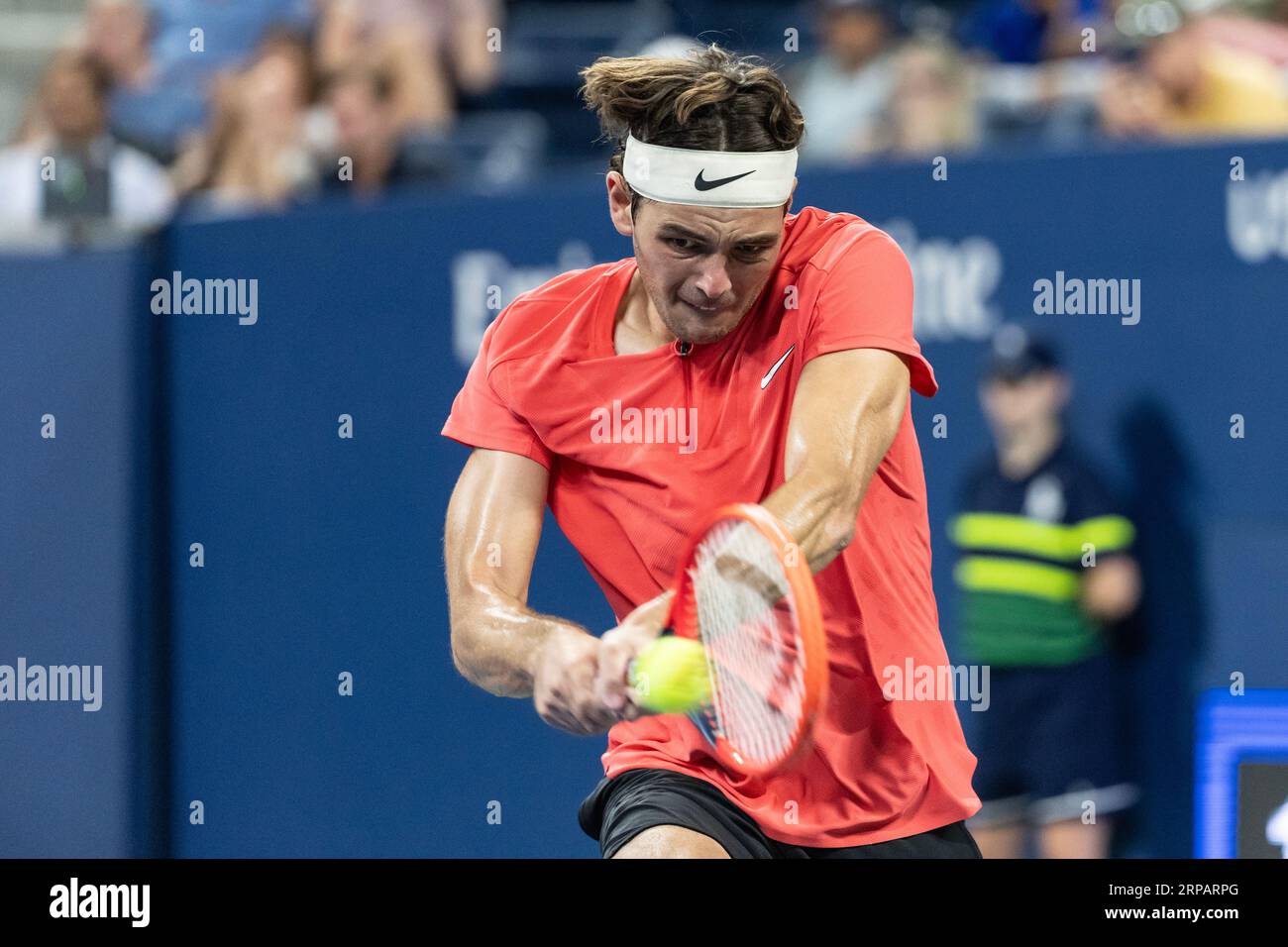 Taylor Fritz of USA returns ball during 4th round against Dominic ...