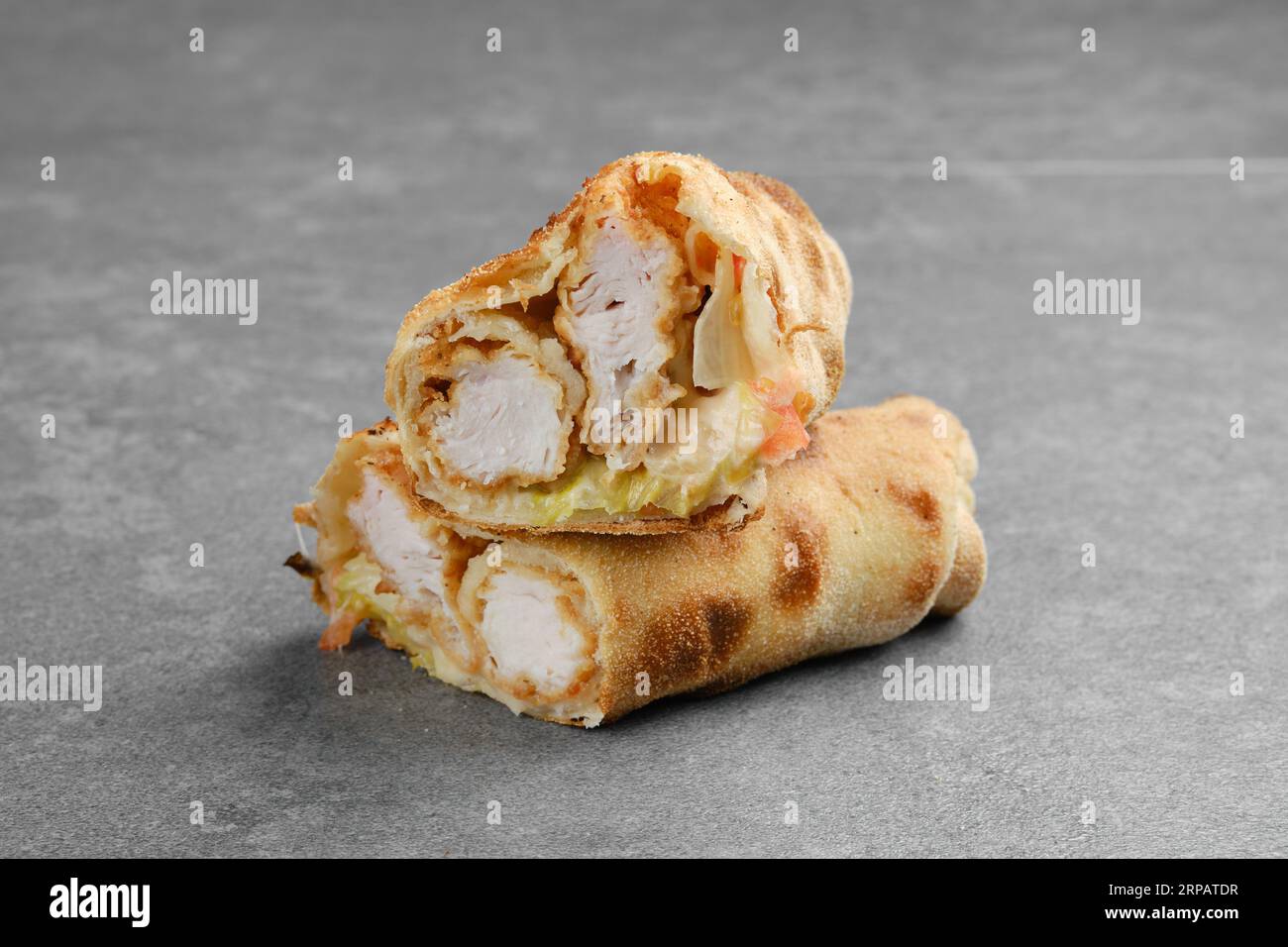 Chicken fillet rolled and baked in dough with cabbage, tomato and ...