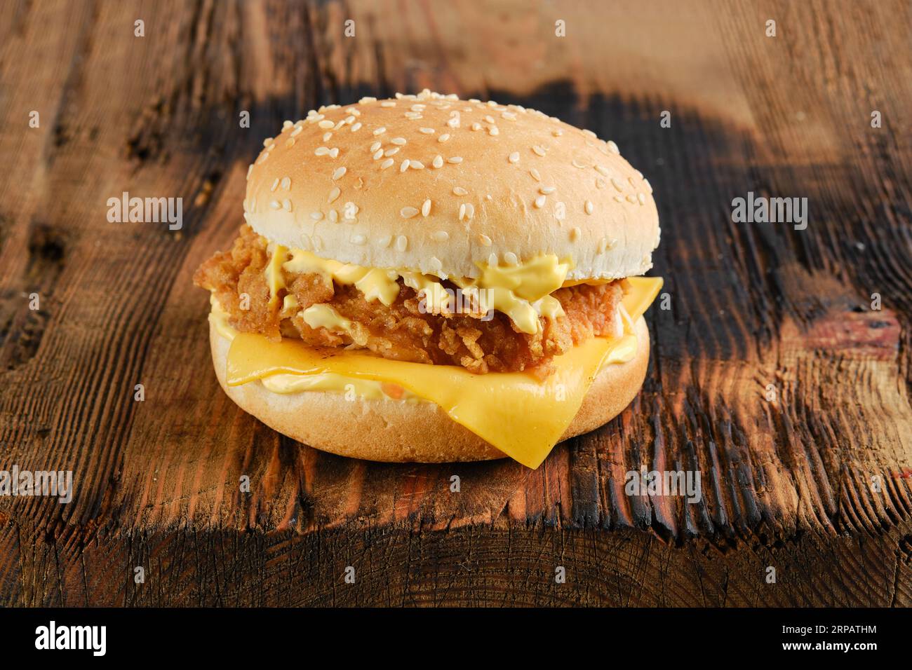Little cheeseburger junior with meat patty in breading Stock Photo - Alamy