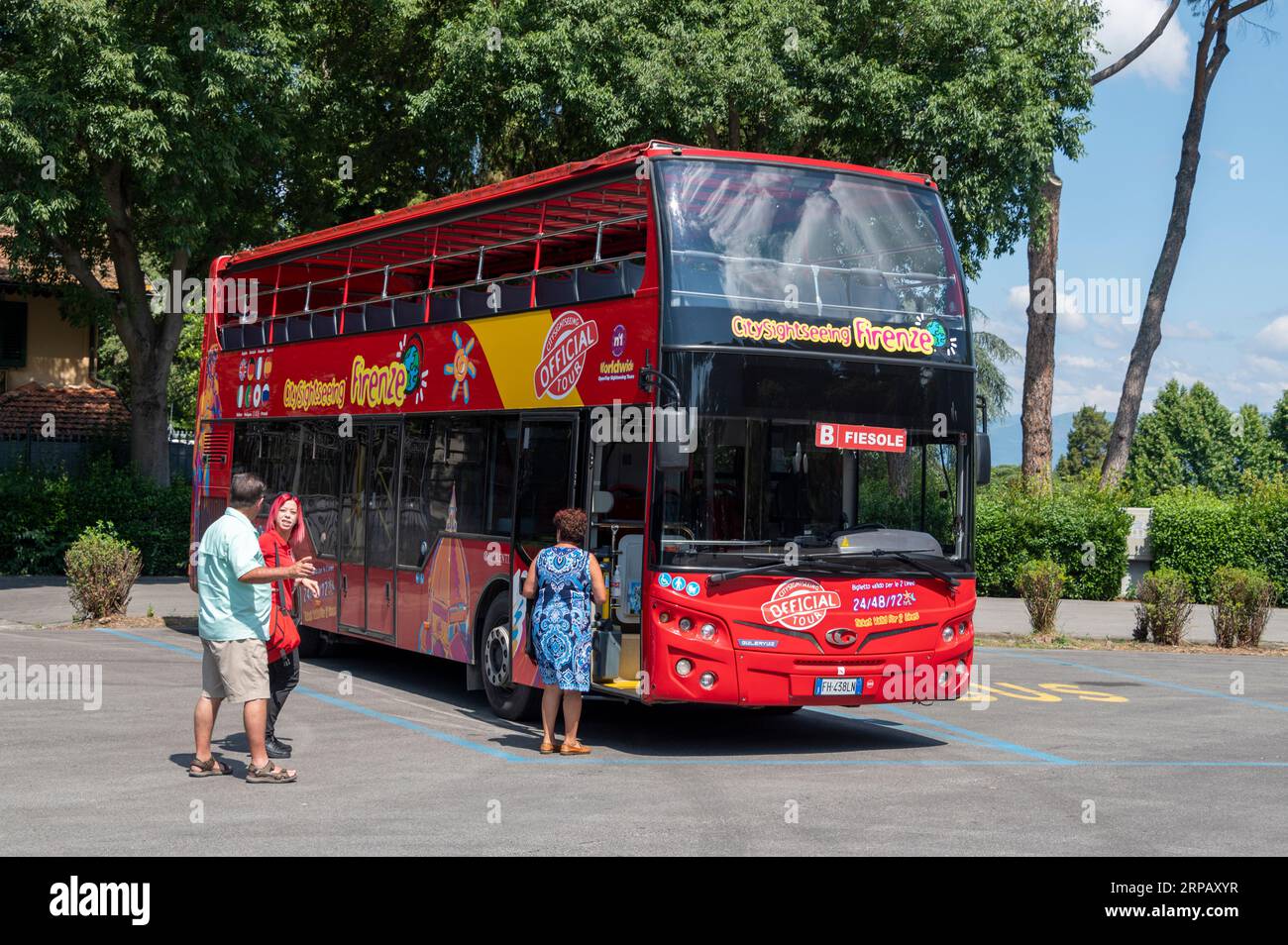 Tourists boarding a Florence sightseeing bus that can be used for Hop ...