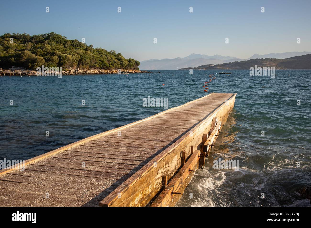 Summer Scenery of Wooden Pier in Ksamil. Low Angle of Ionian Sea, Blue ...