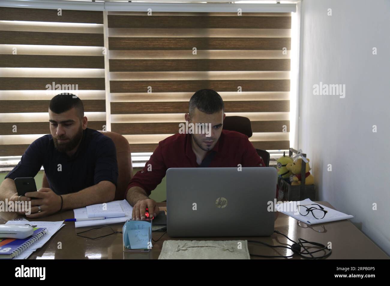 (190523) -- GAZA, May 23, 2019 -- Palestinian young men Amin Abed (R ...