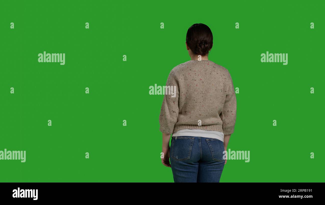 Back view of person showing denial and pushing something aside ...