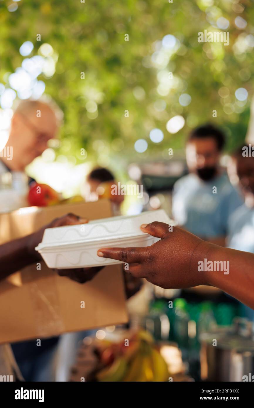 Helping needy person hi-res stock photography and images - Alamy