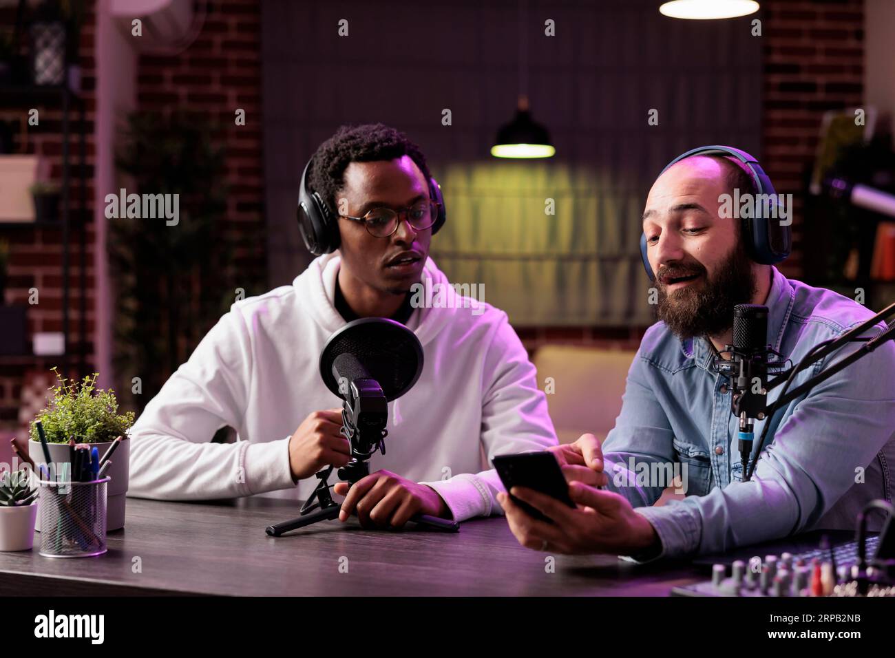 Content creator filming podcast episode showing african american ...