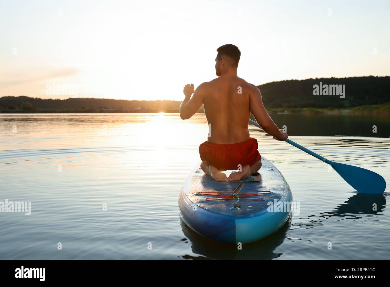 Man sup boarding on hi-res stock photography and images - Alamy