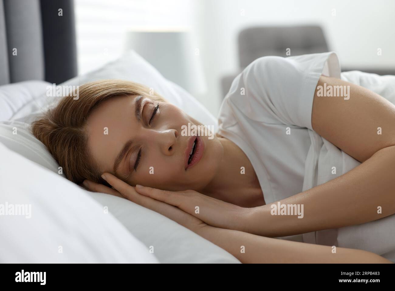 Woman snoring while sleeping in bed at home Stock Photo - Alamy
