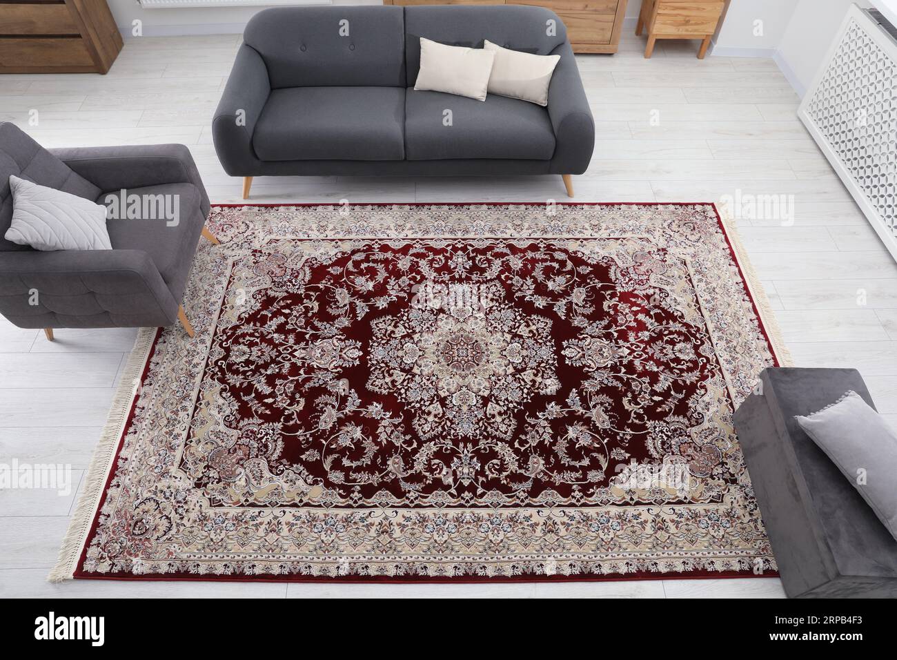 Cozy room interior with stylish furniture and soft carpet with ...