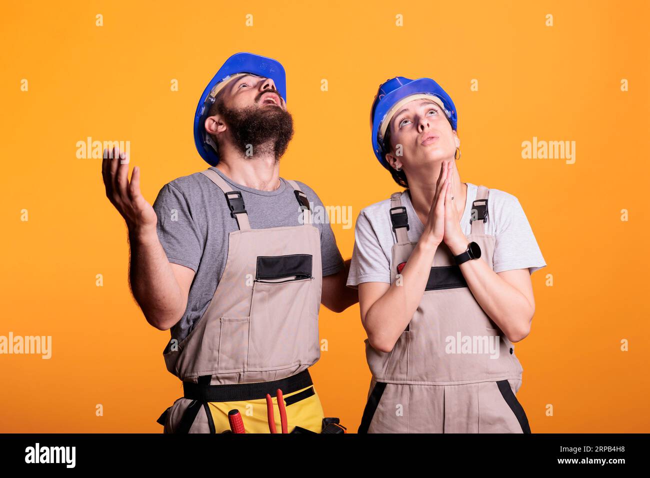 Faithful construction workers praying to god for good projects, begging ...
