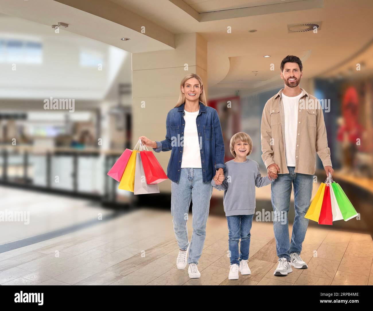 Family shopping bags hi-res stock photography and images - Alamy