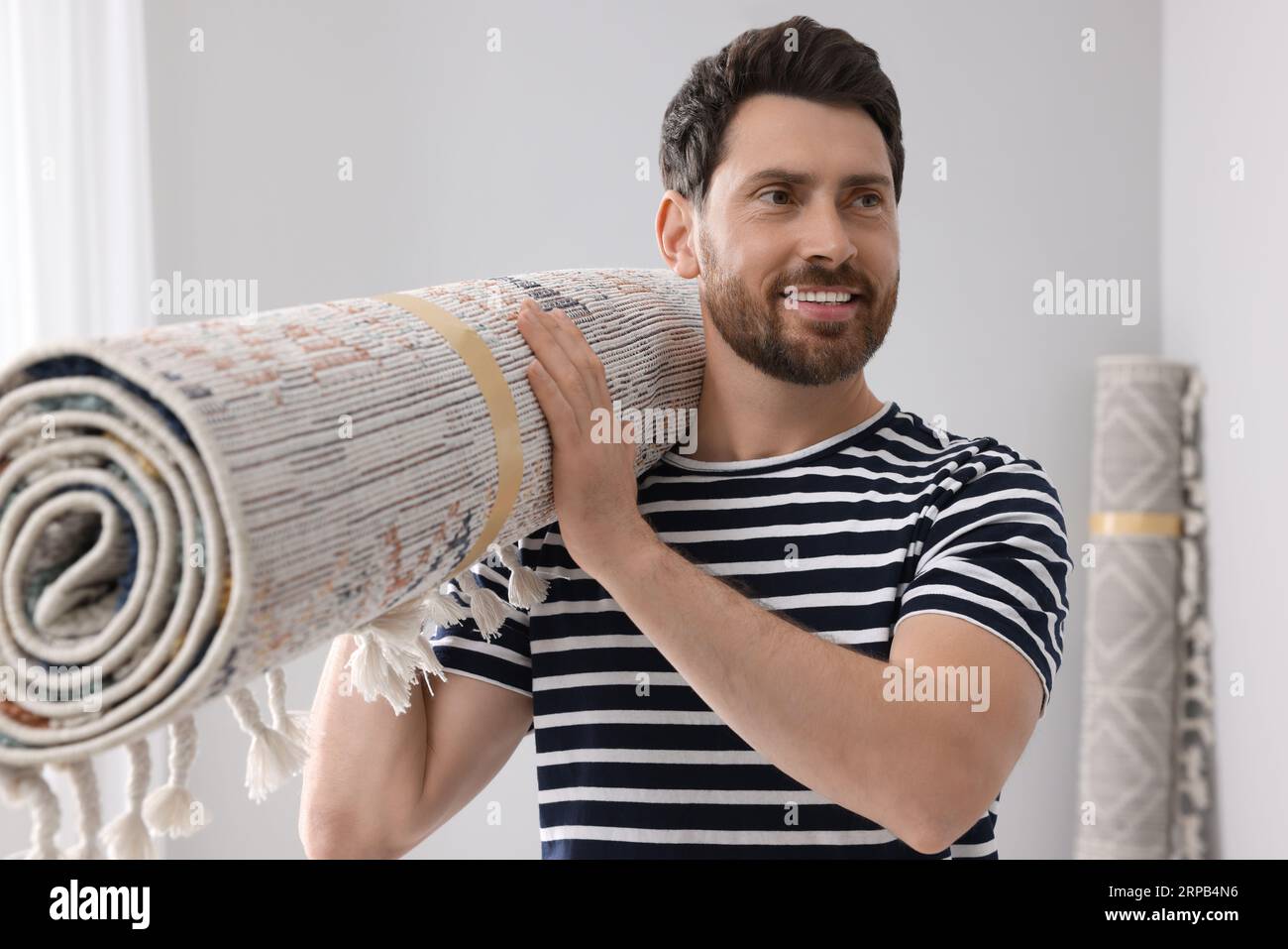 Person in rolled carpet hi-res stock photography and images - Alamy